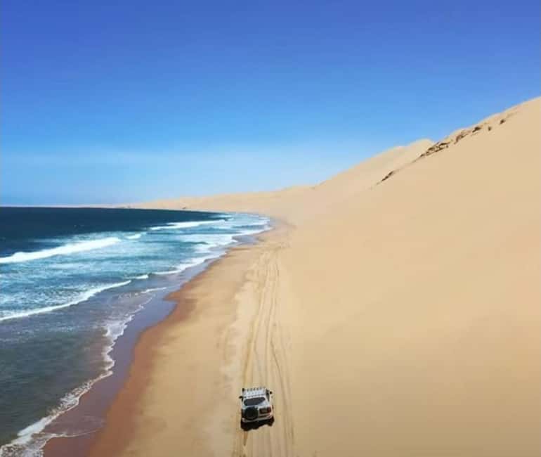 From Doha: Inland Sea Desert Safari with All Activities | GetYourGuide