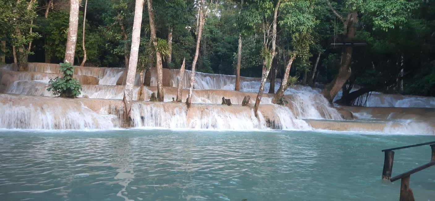 Slow boat to Pak Ou caves and Kuang Si falls Full-day tour | GetYourGuide