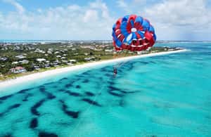 Providenciales: Grace Bay Beach Parasailing Experience | GetYourGuide