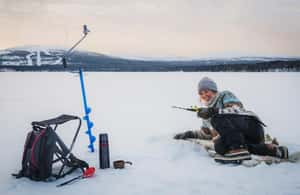 Pyhä: Ice Fishing Experience at Frozen Lake | GetYourGuide