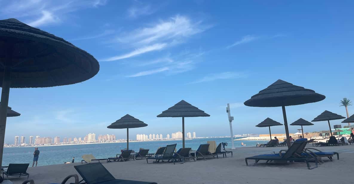 Doha: Doha Sands Beach Club Entry with Sunbed, Towel & Water | GetYourGuide