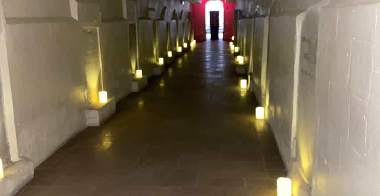 New York City: Catacombs by Candlelight | GetYourGuide