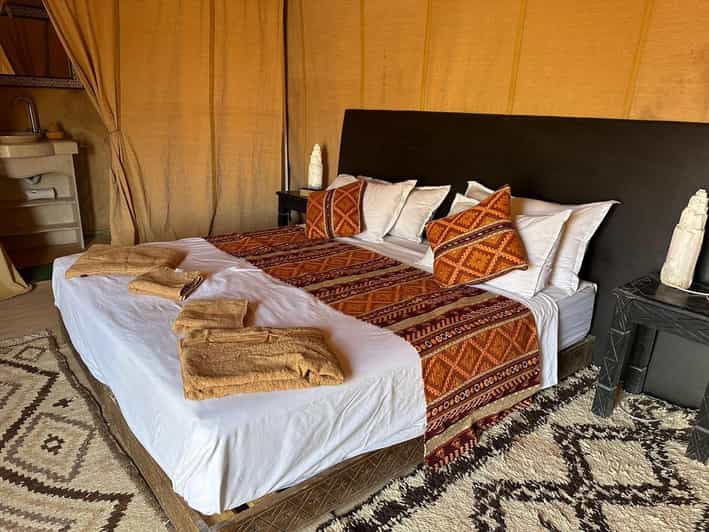 Merzouga: Overnight Camel Trek with Sandboarding | GetYourGuide