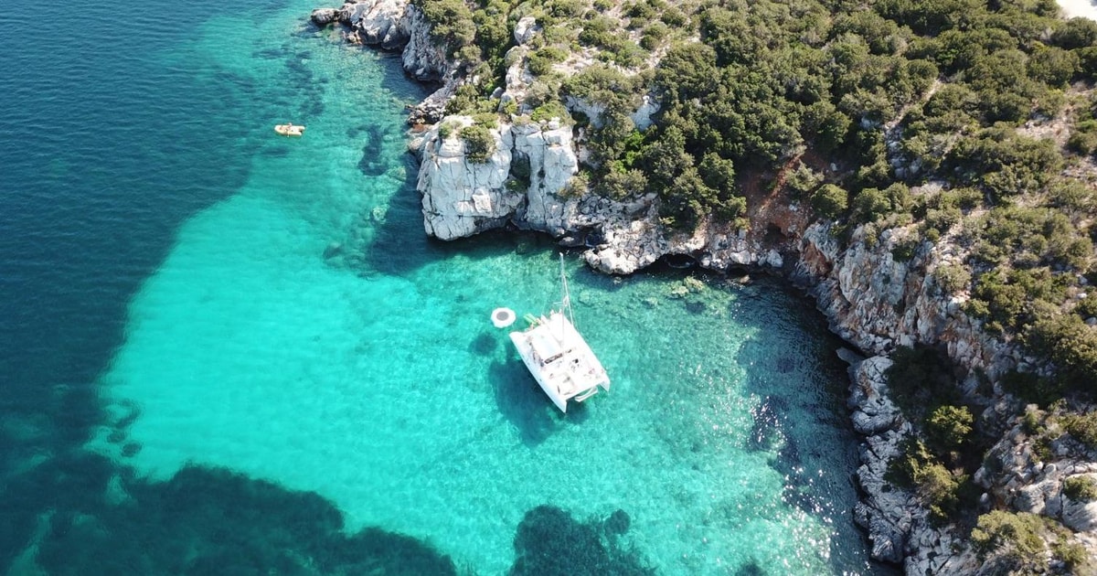 Porto Conte: Half-day catamaran tour with aperitif | GetYourGuide