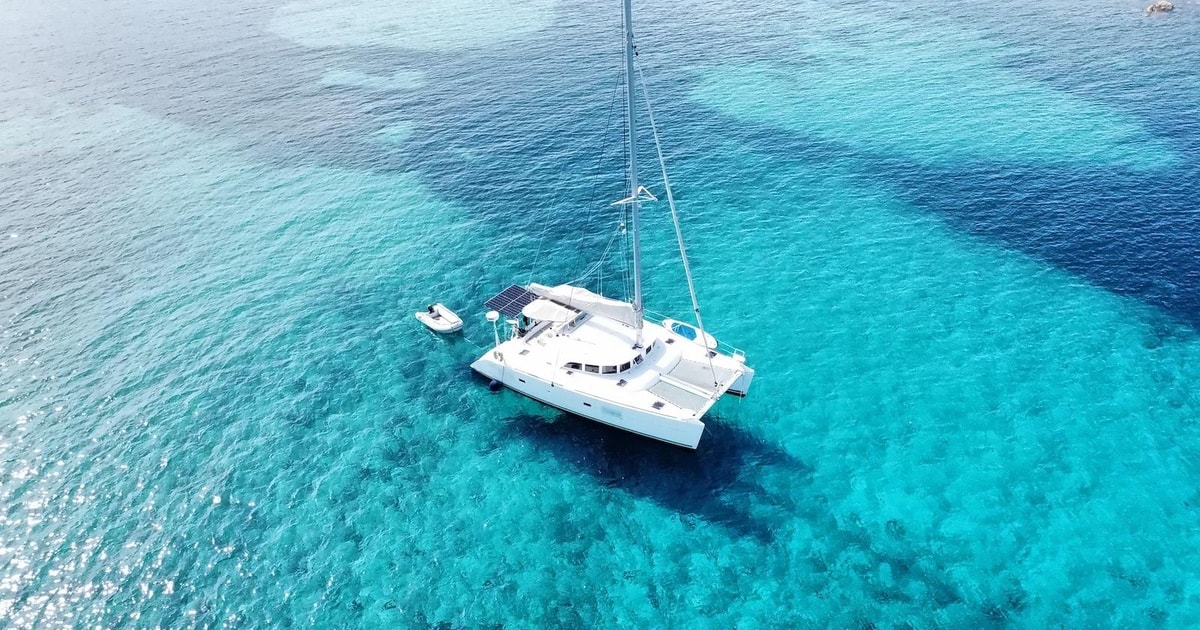 Private exclusive catamaran sailing trip Sardinia from La Caletta ...