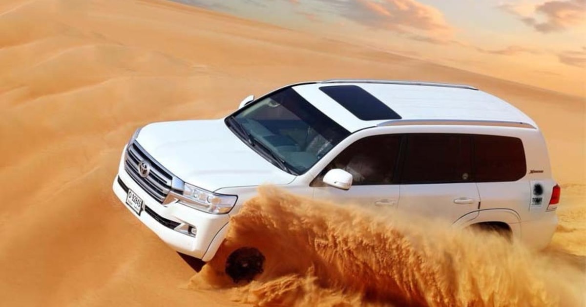 From Doha: Desert Safari With Sandboading & Inland Sea Beach | GetYourGuide