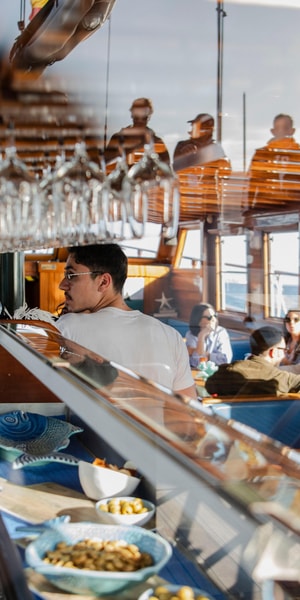 Live Music & Sunset Wooden Boat in Barcelona | GetYourGuide