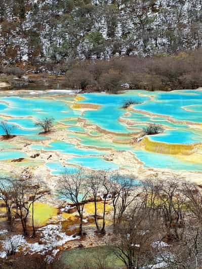 Huanglong Scenic Area: Explore Stunning Five-Colored Ponds | GetYourGuide