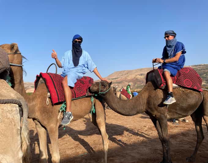 From Marrakech: Agafay Desert Sunset, Camel Ride and Dinner | GetYourGuide