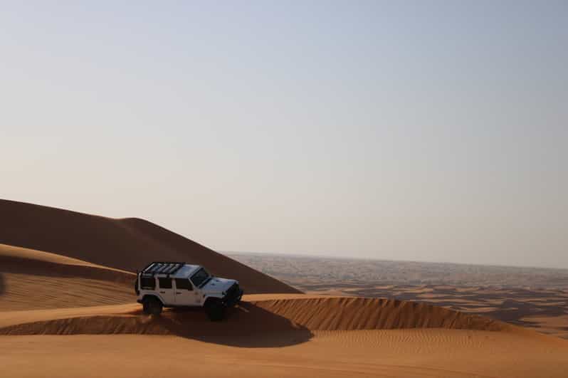 Dubai Jeep Wrangler Sunset Desert Experience & Sandboarding | GetYourGuide