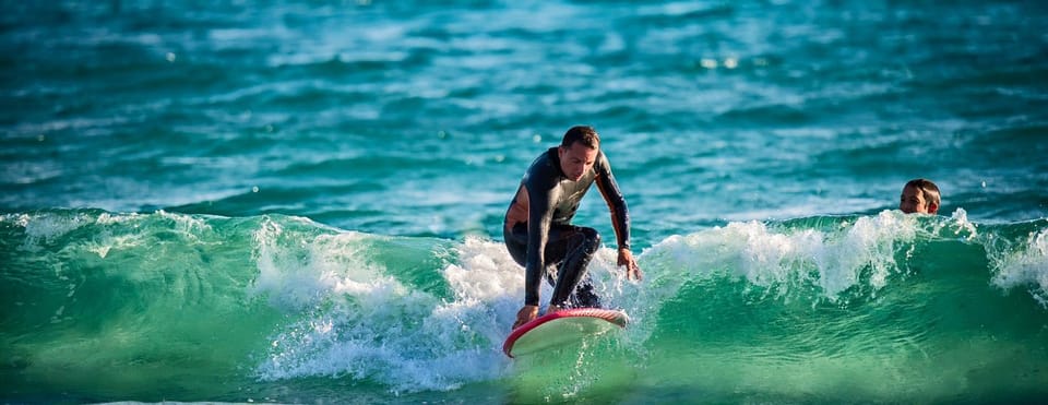 Learn to surf in Mallorca! Mediterranean Sea Surf Lessons | GetYourGuide