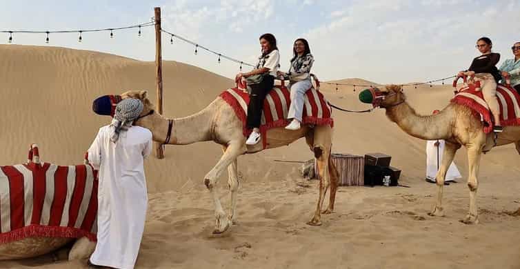 Dubai: Desert Safari, Dinner, Shows, Henna & Camel Riding | GetYourGuide