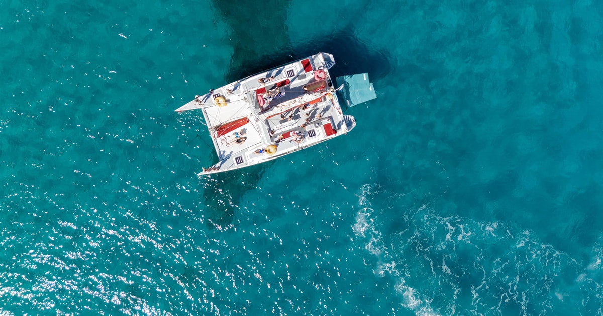 Beach boat on a catamaran ! | GetYourGuide