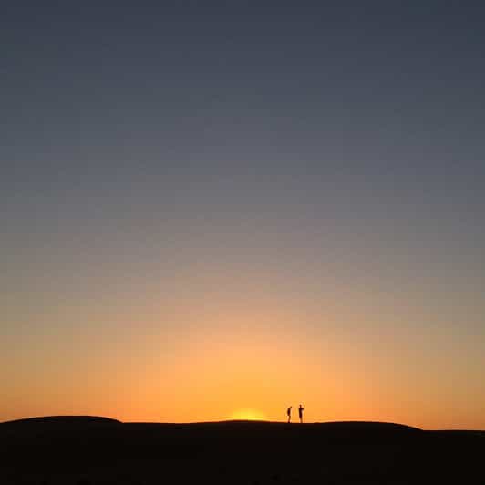 Muscat: Bidiya Desert Sunset Camel Ride with Transfer | GetYourGuide