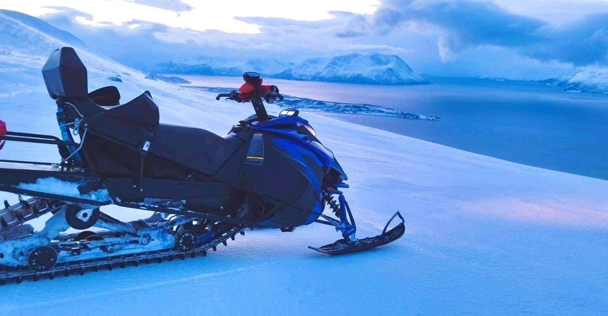 From Tromsø, Lyngen Alps Guided Snowmobile Tour with Lunch | Adventure ...