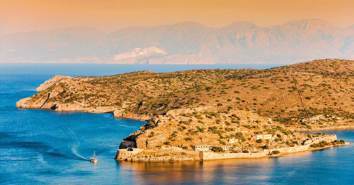 Spinalonga with Guide, Mirabello Bay cruise, Swimming & BBQ | GetYourGuide