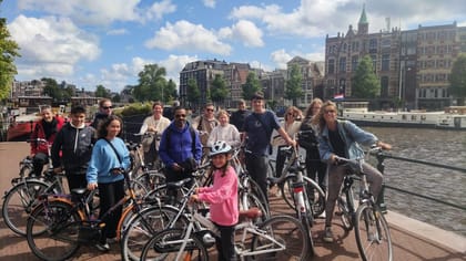 Visit Amsterdam by Bike with a local French guide | GetYourGuide