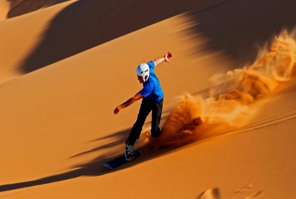 Dubai: Desert Safari, Shows, BBQ, Camel & Sandboard ride | GetYourGuide