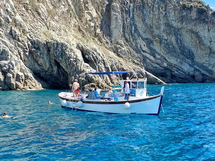 Cinque Terre Sunset Boat Tour on traditional ligurian gozzo | GetYourGuide