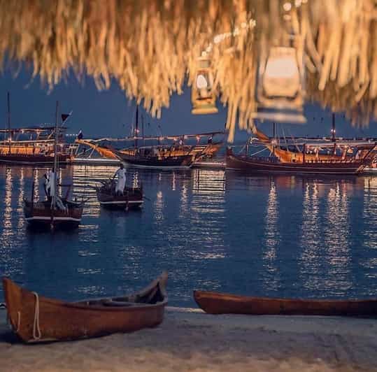 Doha: traditional Dhow Harbour, Skyline view , Sunset | GetYourGuide