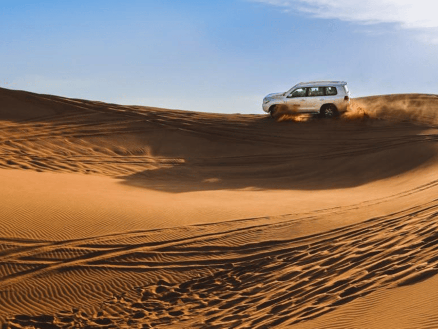 Dubai: Dune Bashing, Dune Buggy, Camel Ride & BBQ Dinner | GetYourGuide