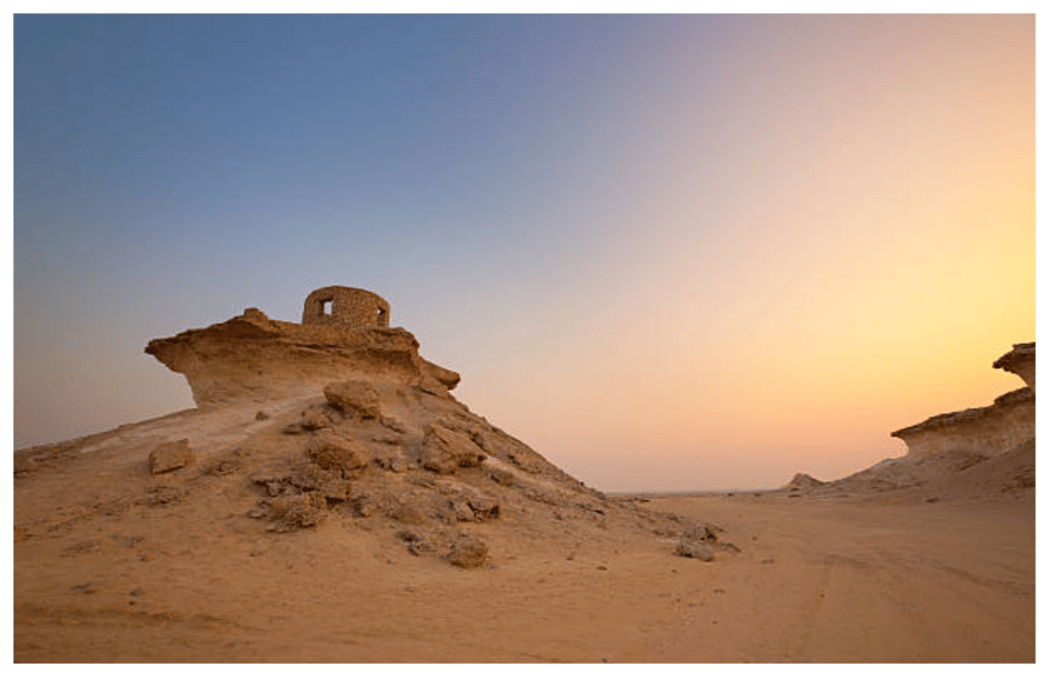 Doha:West tour to Richard Sierra sculpture, Umbrella Rock | GetYourGuide