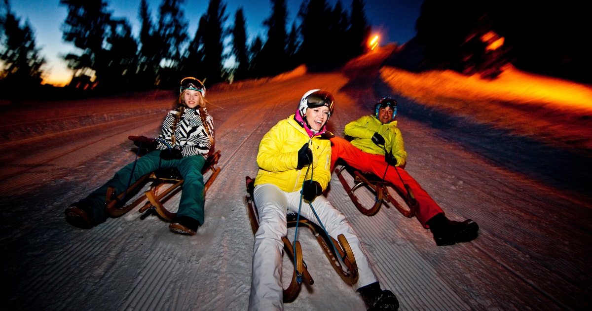 From Interlaken: Night Sledding with Cheese Fondue Dinner | GetYourGuide
