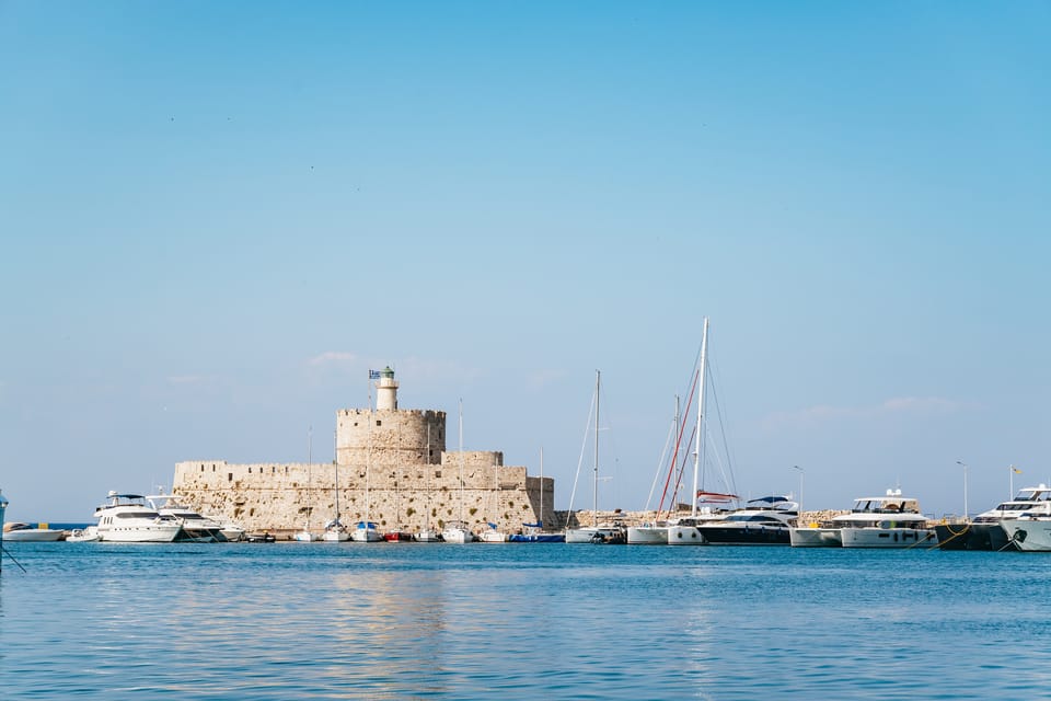 Rhodes: Sunset Catamaran Cruise with Dinner | GetYourGuide