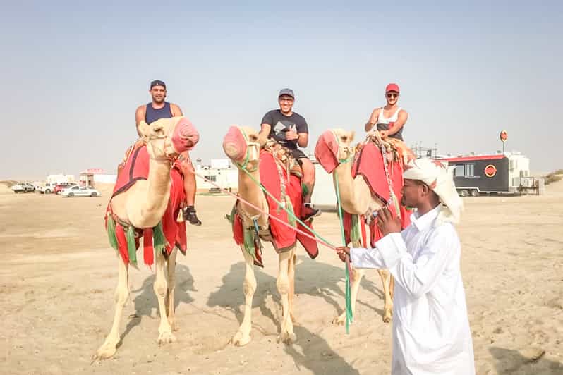 Doha: Sunset Desert Safari with Camel Ride and Sandboarding | GetYourGuide
