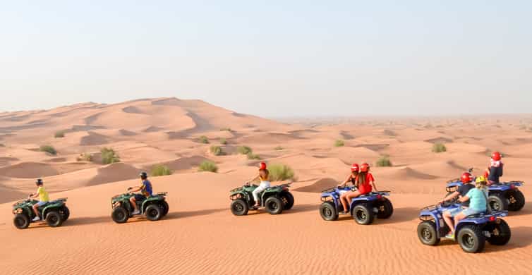 Dubai: Desert Quad Bike Safari, Camel Ride, Sand Surf, & BBQ | GetYourGuide