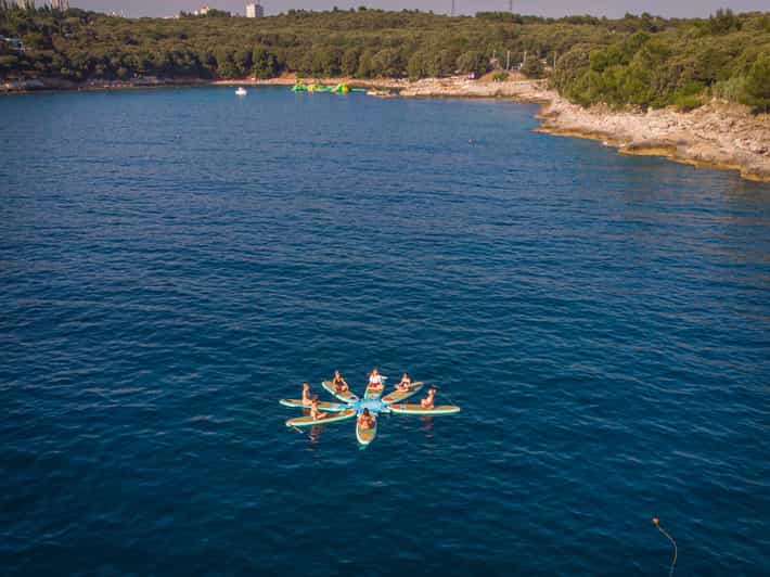 Pula: Stand-Up Paddleboard Yoga Classes at Morning & Sunset | GetYourGuide