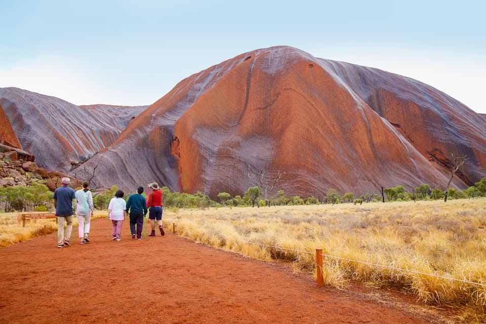 Uluru: Guided Walking Tour at Sunrise with Light Breakfast | GetYourGuide