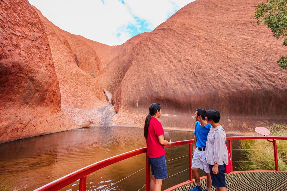 Uluru: Guided Walking Tour at Sunrise with Light Breakfast | GetYourGuide