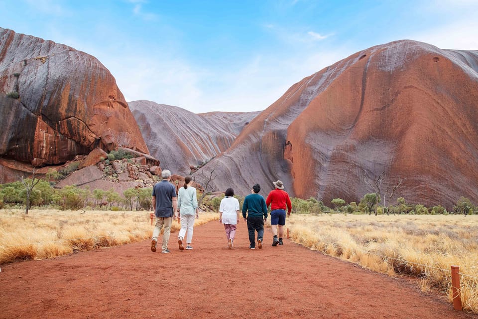 Uluru: Guided Walking Tour at Sunrise with Light Breakfast | GetYourGuide