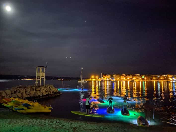Split: Stand Up Paddleboard Night Glow Tour | GetYourGuide