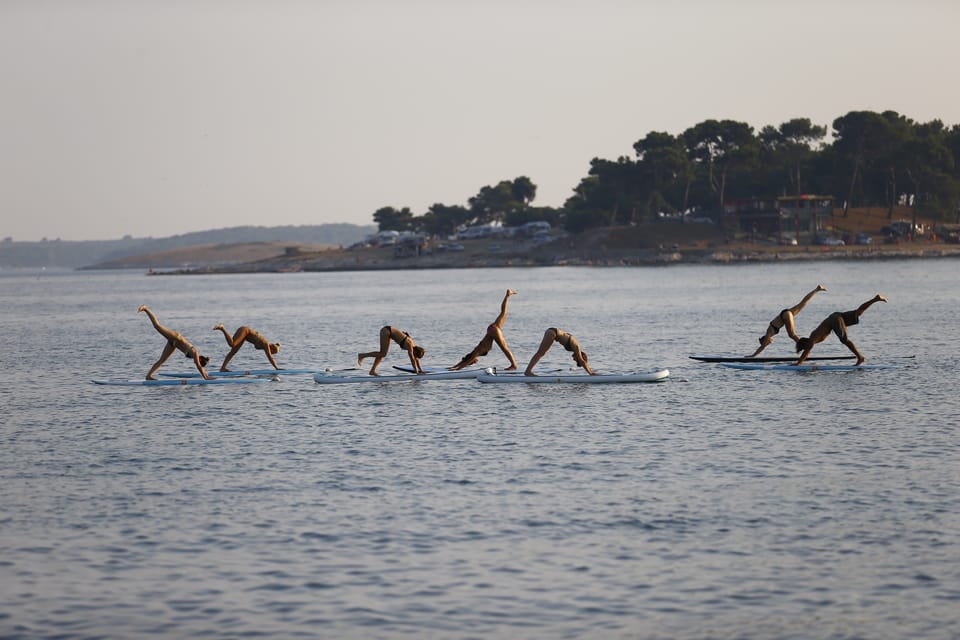 Pula: Stand-Up Paddleboard Yoga Classes at Morning & Sunset | GetYourGuide