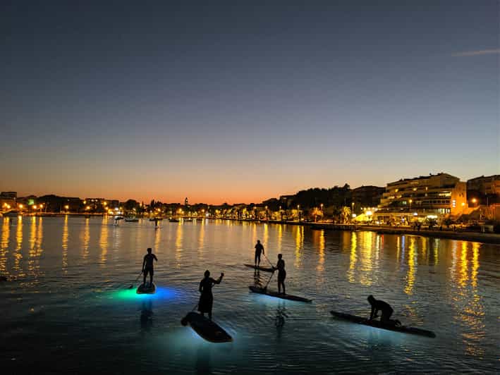 Split: Stand Up Paddleboard Night Glow Tour | GetYourGuide