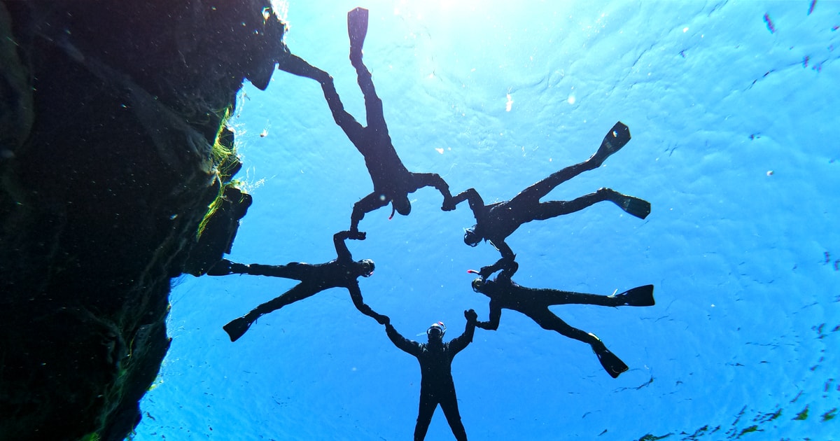 Silfra: Half-Day Snorkeling Day Trip with Underwater Photos | GetYourGuide