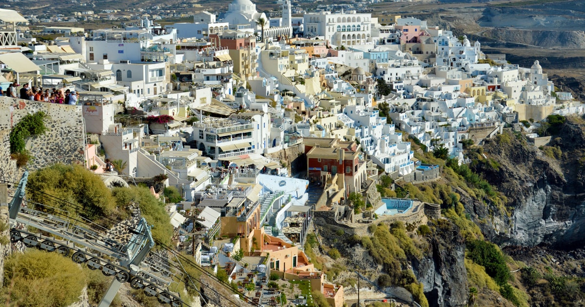 Fira: Walking Tour with Cable Car Ride | GetYourGuide