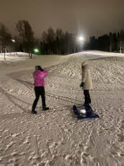 Tromsø: Snow Sledding with Reindeer Skins and Hot Beverages. | GetYourGuide