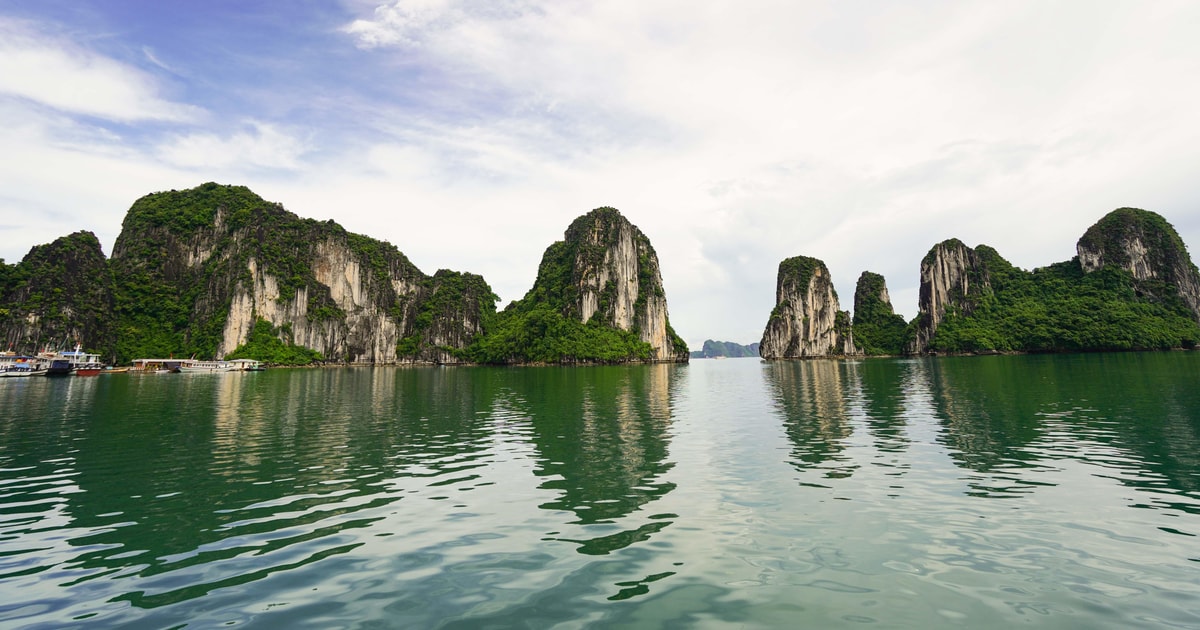 Explore Ha long Bay With Thien Cung Cave, Kayak, Lunch, Bus | GetYourGuide