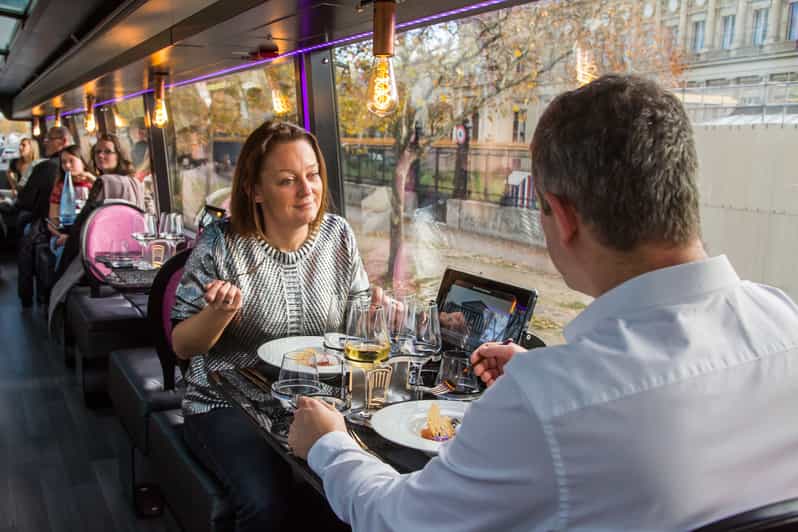 Bus Toqué Champs Elysées Tour w/ 3-Course Dinner & Champagne | GetYourGuide