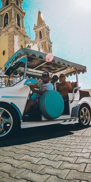 Mazatlan: City Tour in a Traditional "Pulmonia" Open-Air Car | GetYourGuide