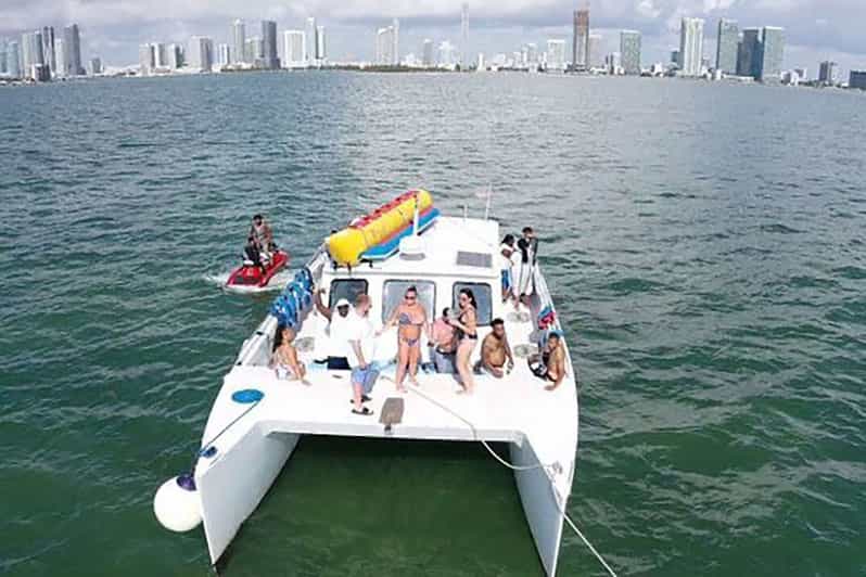 Miami: Boat Tour with Drinks, Music, Tubing, and Jet Skis | GetYourGuide