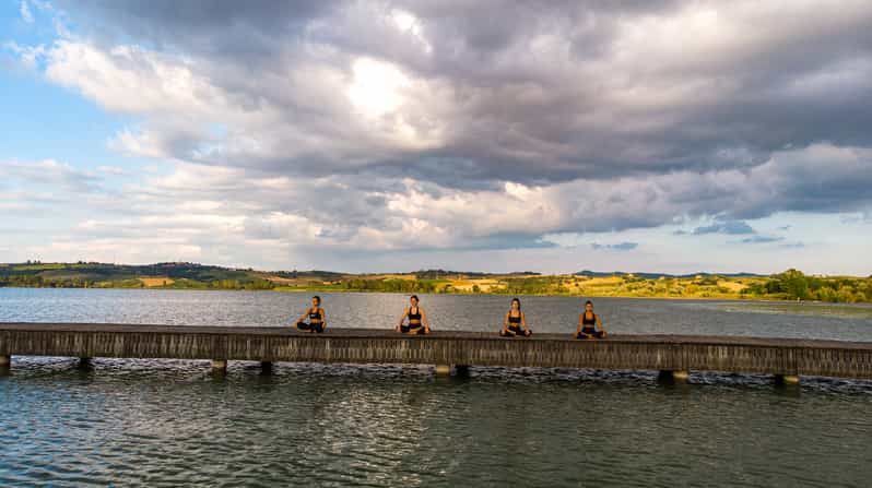 Chiusi: Yoga Lesson and Picnic on the Shore of Chiusi Lake | GetYourGuide