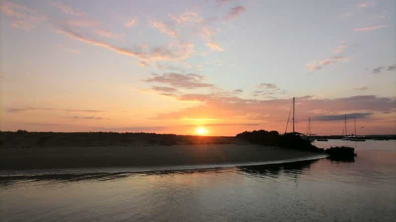 Faro: Ria Formosa Guided Sunset Tour by Catamaran | GetYourGuide