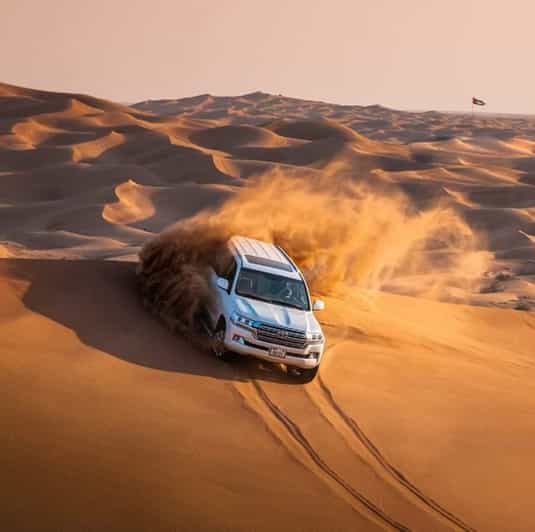 Dubai: Red Dunes Evening Quad Bike, Dune Blast with BBQ | GetYourGuide