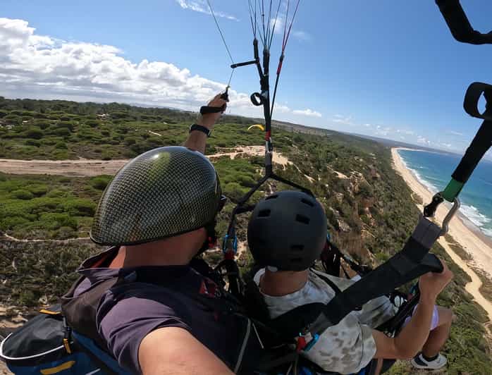 From Lisbon: Paragliding Pack (Flight+Video+Transportation) | GetYourGuide