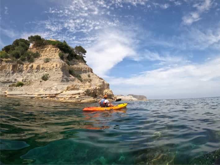 Alicante: Guided Kayak Tour Through Moraira with Snorkeling | GetYourGuide