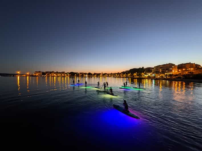 Split: Stand Up Paddleboard Night Glow Tour | GetYourGuide